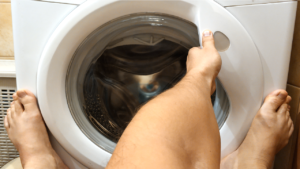 How to open an Indesit washing machine if it is locked